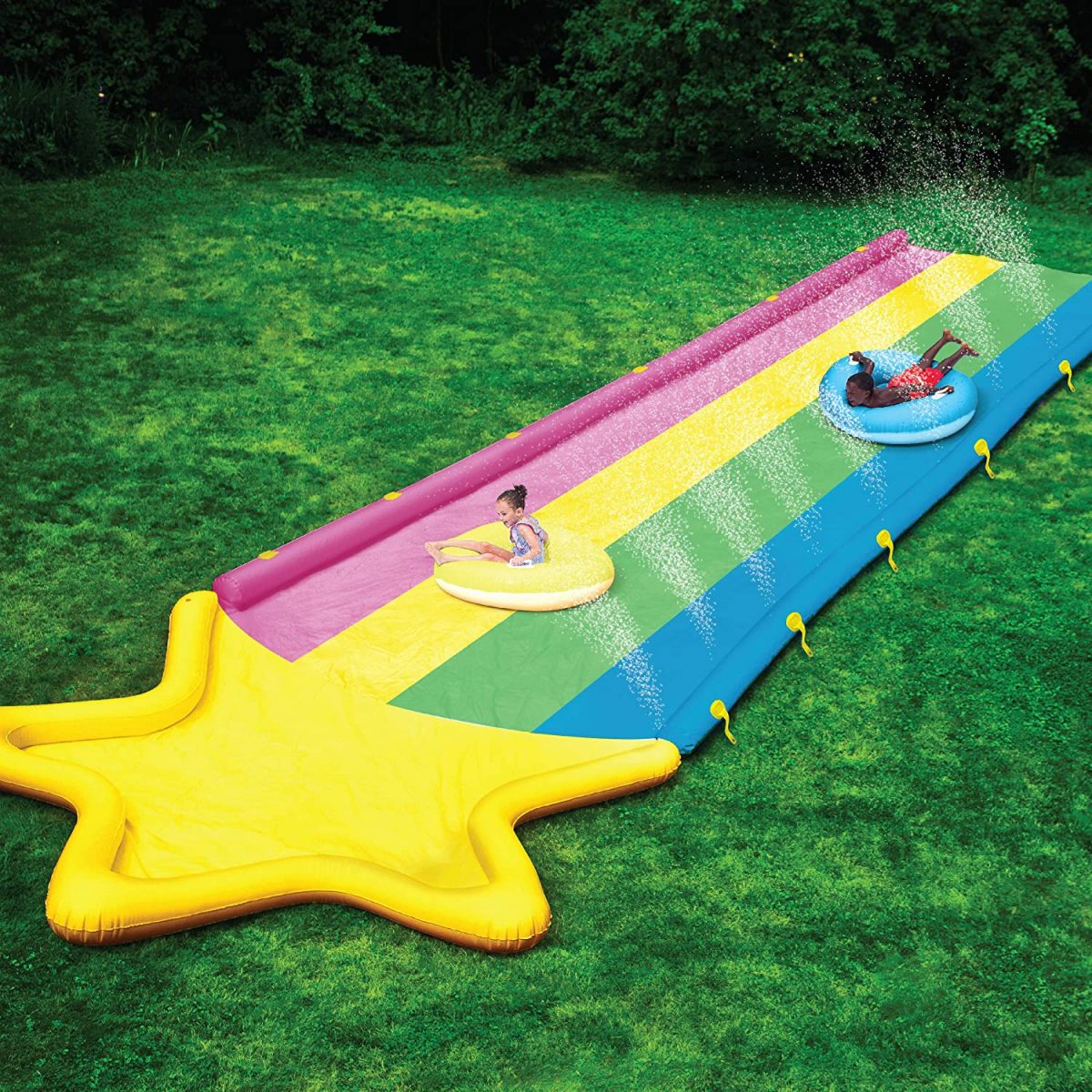 This Enormous Rainbow Slide Has a Pool & a Sprinkler! - Tinybeans