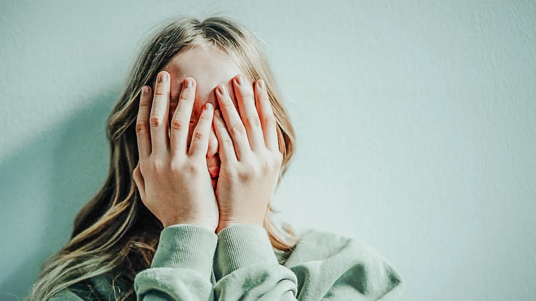 Why Are Gen Z Kids Covering Their Noses in Family Photos?